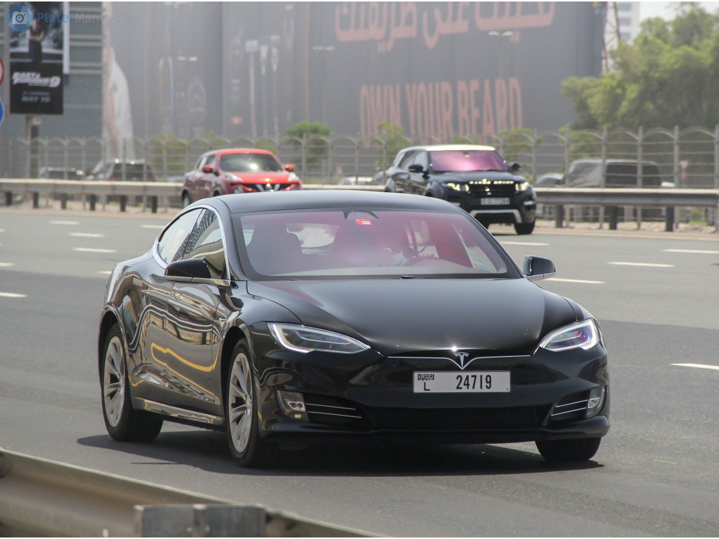"L 24719" photos Tesla Model S. UAE